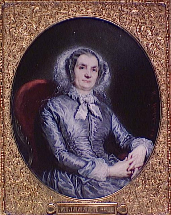 Mme Andryane assise dans un fauteuil, âgée, les deux mains visibles ...